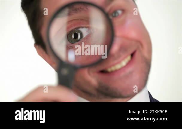 Male looking through magnifying glass. Business emotions. The ...