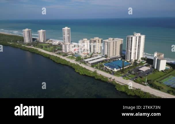 This 4K aerial drone footage captures the stunning oceanfront condos in ...