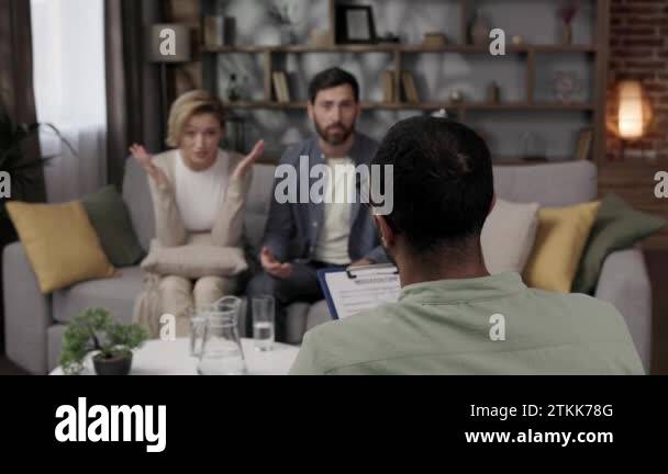 A quarrel between a husband and wife at a psychotherapists appointment ...