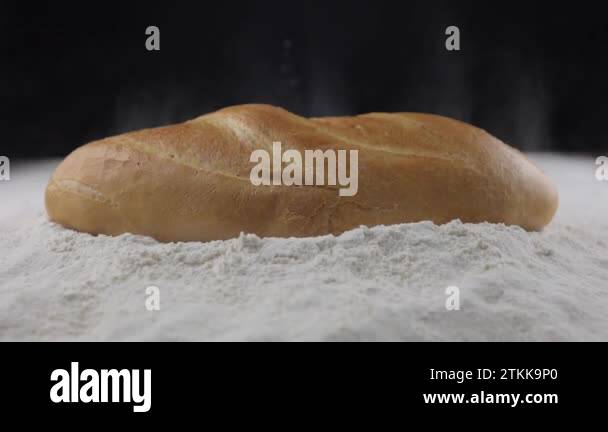 Baking. Baked bread. Bread on flour, a lot of white flour. Loaf with a ...