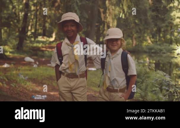 Medium portrait of two cheerful Caucasian and African American boy ...
