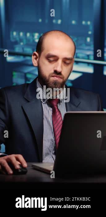 Vertical video: Information security officer finishing digitalization ...