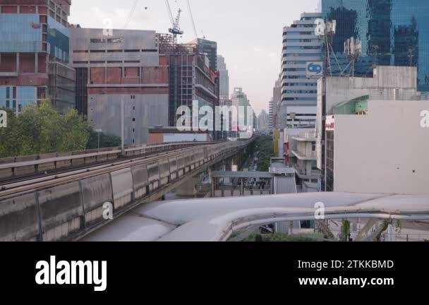 The Bangkok Mass Transit System BTS Skytrain Moving Between Buildings ...