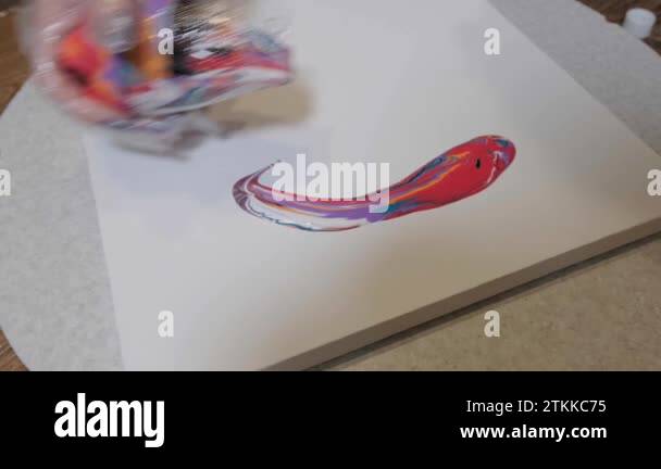 Painting with liquid ink. Abstract ink painting. The artist creates a ...