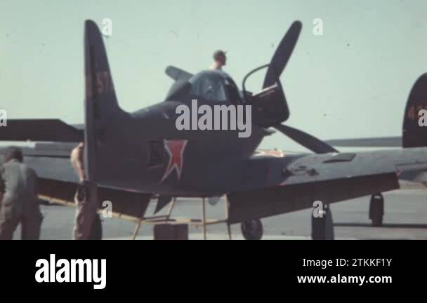 Mechanics preparing World War II fighter planes for flight in a rare ...