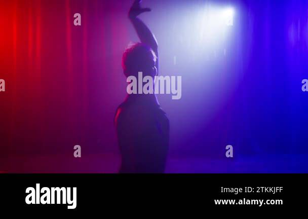 Perfect female body with neon beams glowing on background with falling ...