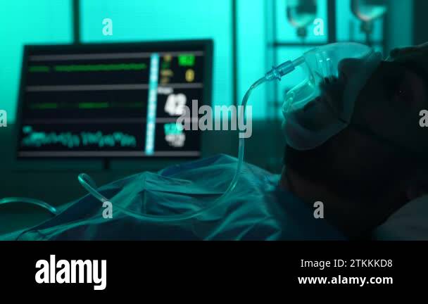 Close-up detail video of a patient on breathing support dying in a ...