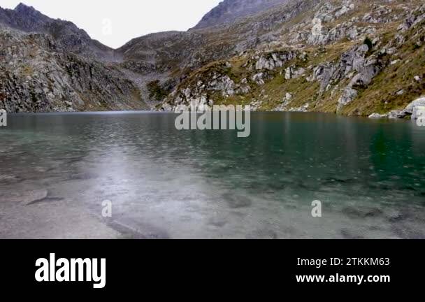 Rainy day on the glacial lake of lambin Stock Video Footage - Alamy