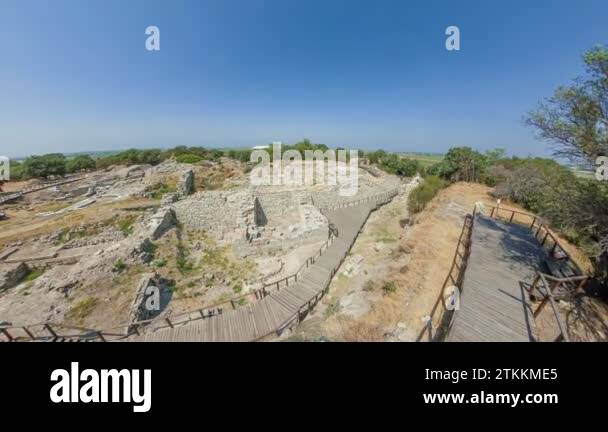 Visitors of Troy explore ruins, including iconic walls and famous ...