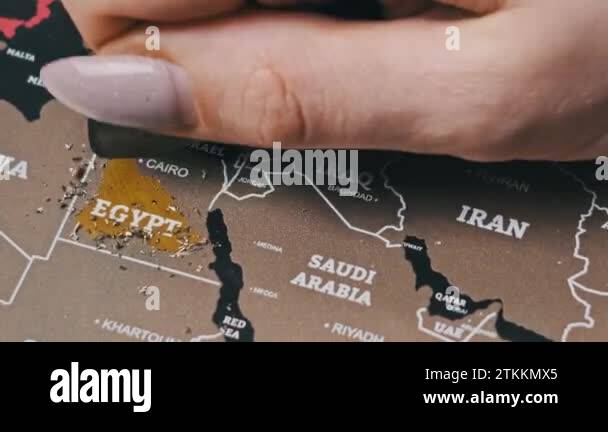 Scratching Egypt Country on the Surface of Scratch World Map. Woman ...