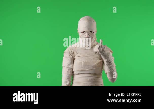 Green screen isolated chroma key video capturing a mummy giving a ...