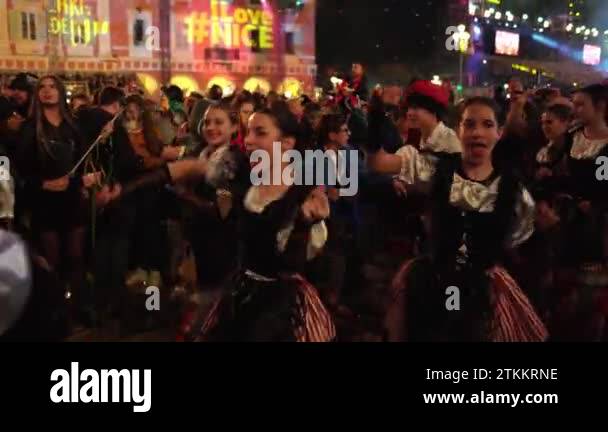 Carnival in Nice. Parade of light. Colorful images in masks. Tourists ...