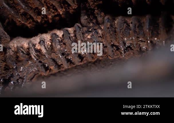 Pipes in soot inside solid fuel boiler for long burning close-up.The ...