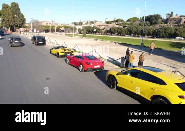 ROME, ITALY - NOVEMBER 7, 2022: Three parked sports cars on the side ...