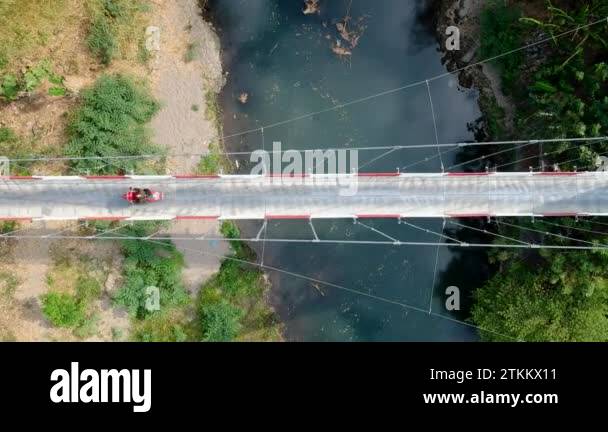Aerial footage of the suspension bridge which can only be used by two ...