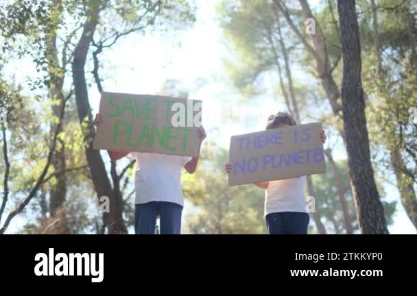 volunteer kids with Save the planet Poster. boy child activist holding ...