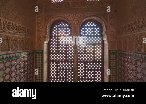 Camera moves to arches of the window between the walls with Moorish ...