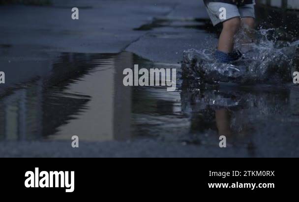 Jumping in puddle splashing Stock Videos & Footage - HD and 4K Video ...