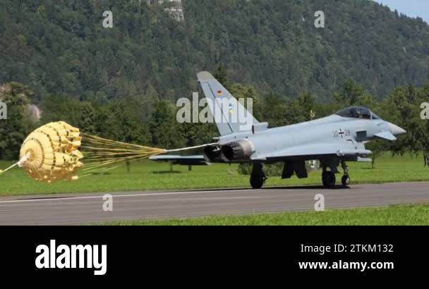 Modern Fighter Jet Rolls Down Runway with Parachute Still Attached ...