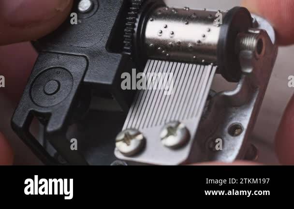 Music box mechanism close-up. Old music box clockwork device on ...