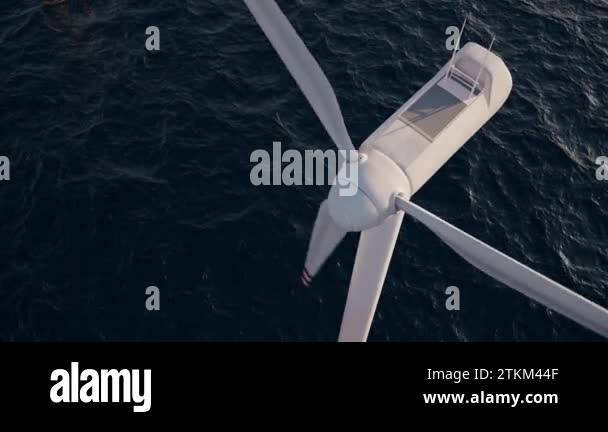 Wind turbines in the ocean.Camera pans around the head of a wind ...