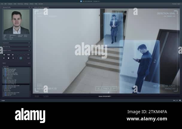 Playback office CCTV camera on computer. Workers walk in business ...