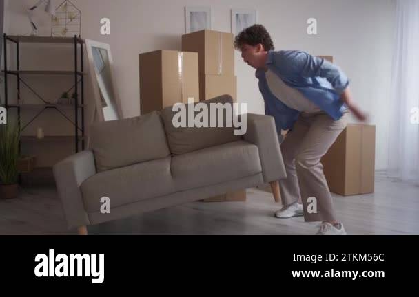 Hard moving. Weak man. Health problem. Casual guy suffering from pain ...