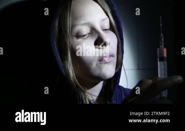 Teen girl. Drug addiction. Depressed face of a teen girl with overdose ...