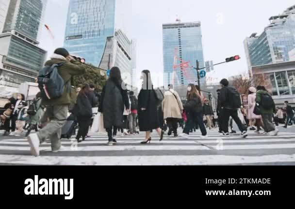 Tokyo, Japan - Dec 7, 2022: Crowd people walk cross Shibuya scramble ...