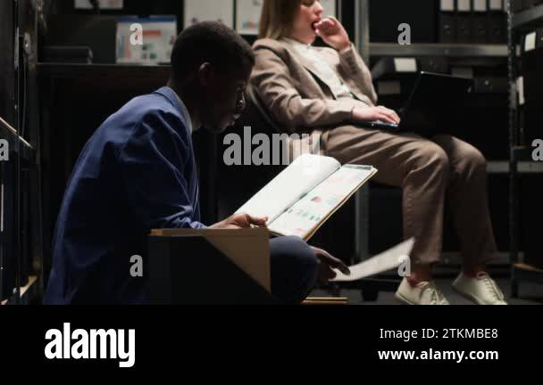 African American detective and caucasian officer work together in ...