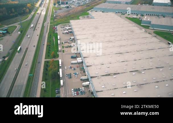 Logistics park with a warehouse - loading hub. Semi-trucks with freight ...