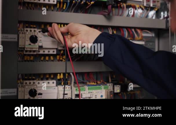 Tests wiring, Safety protocols, Industrial wiring. At manufacturing ...