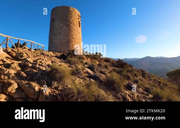 Sunrise over Mediterranean sea. Historic Torre Vigia De Cerro Gordo, a ...