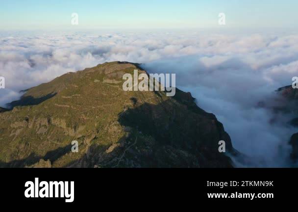 Gigantic drone aerial view over Pico Ruivo with a view of Pico do ...