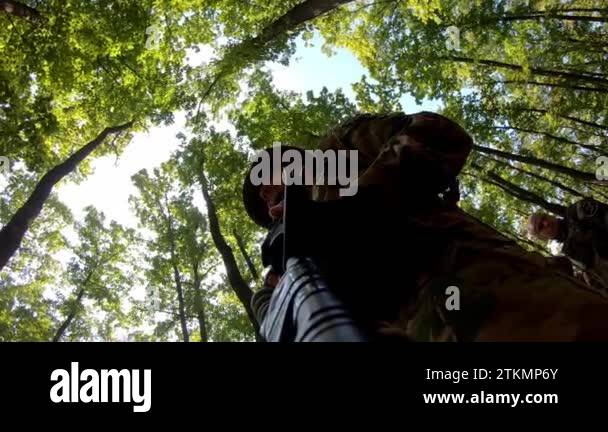 The camera on the bath of weapons. The military sniper in the helmet is ...
