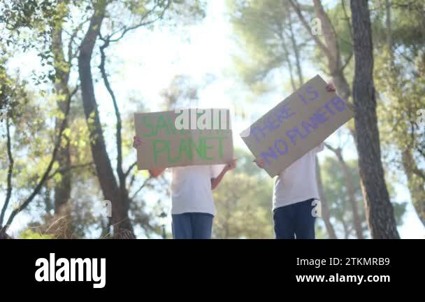 volunteer kids with Save the planet Poster. boy child activist holding ...