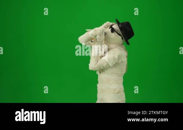 Green screen isolated chroma key video capturing a mummy wearing ...