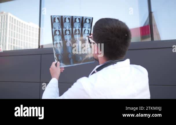 Doctor examines CT scan of chest and abdomen. X-ray or mri for the ...