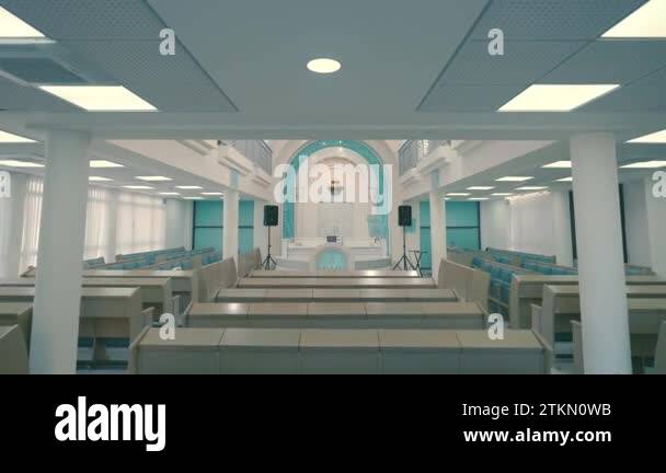 Hall of a synagogue with seating and bookshelves by the wall Stock ...