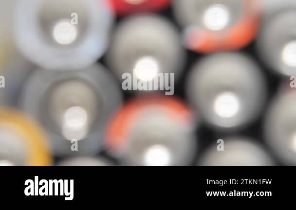 Different types of accumulators and batteries rotate on the turntable ...