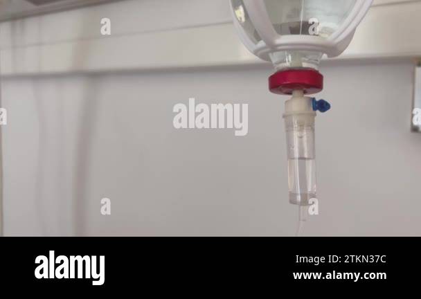 4K. Closeup of IV drip in hospital, Intravenous saline solution. Saline ...