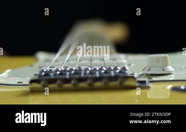 Macro shot of 6 string electric guitar. reveals the intricate details ...