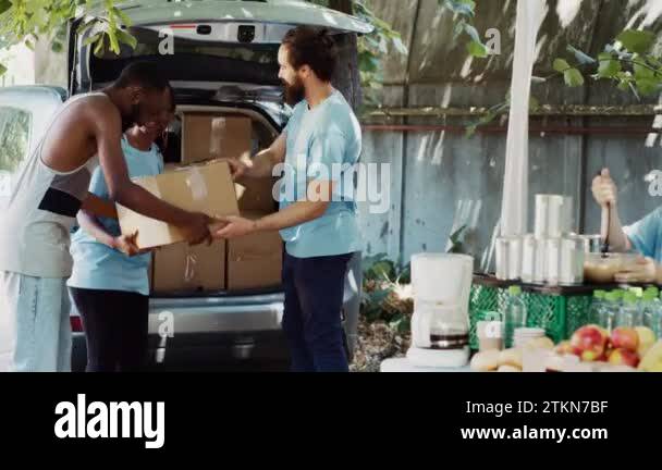 Various people handing out contribution boxes to those in need at a ...