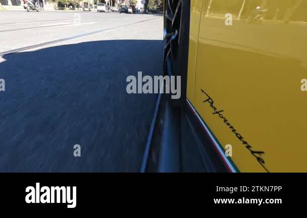 ROME, ITALY - NOVEMBER 7, 2022: Exclusive yellow Lamborghini driving ...