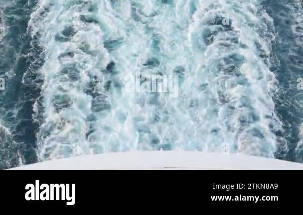 view of the wake behind a large cruise ship boat at deep international ...