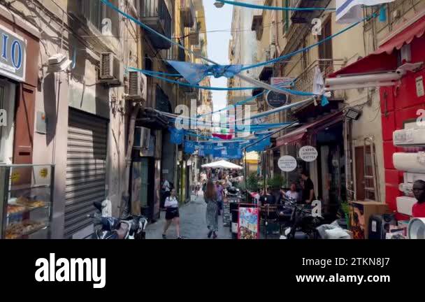 Via dei Tribunali central busy street in Napoli old town. Italian ...