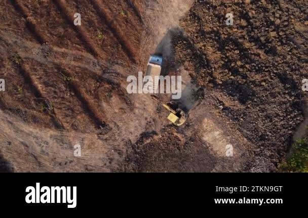 Excavator dig ground at construction site. Aerial view of a wheel ...