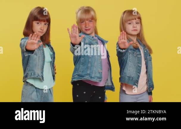 Stop. Teenage girls say No hold palm folded crossed hands in stop ...