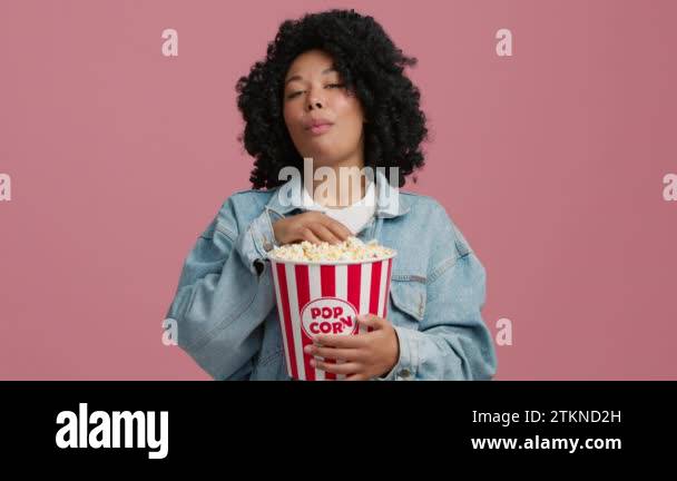 Cheerful brunette African American woman of color in blue denim jacket ...