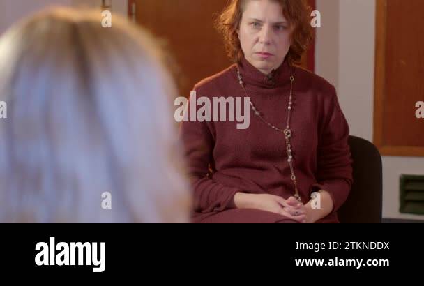 Practice empathetic listening. Woman silently looks and listens to the ...